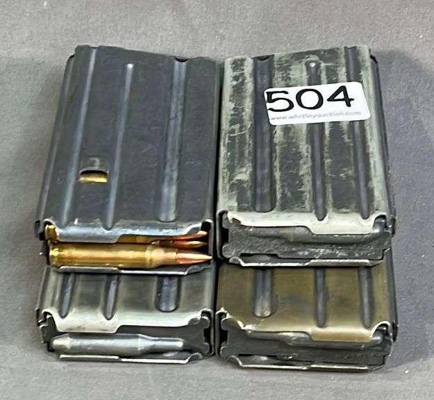 4 Vintage M16/M16A1 5.56mm Magazines. One magazine has cartridges & an ...