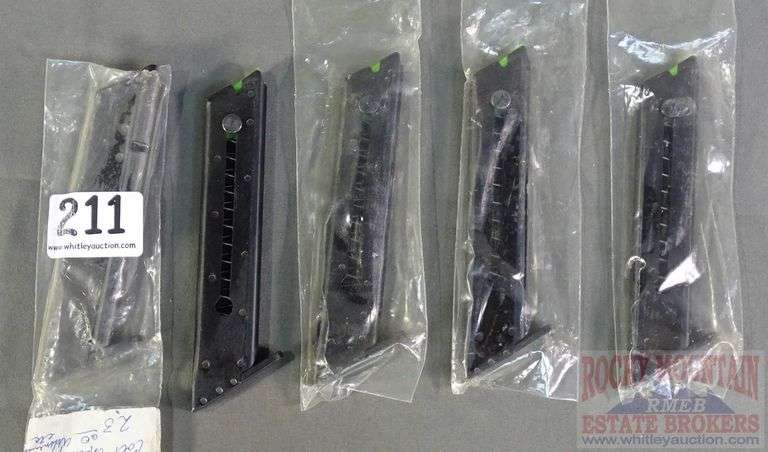 5 - .22LR Magazines, One has a tag that identifies it as a "Colt ...