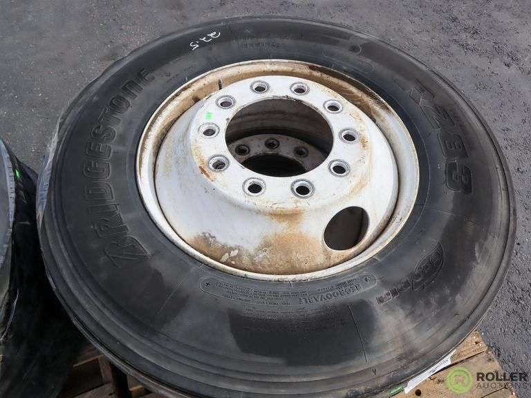 (2) Bridgestone R283 11R22.5 Tires With Wheels - Roller Auctions