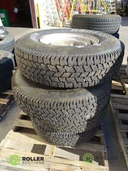 (4) Michelin XCX/APT LT235/85R16 Tires With 8-Lug Rims - Roller Auctions