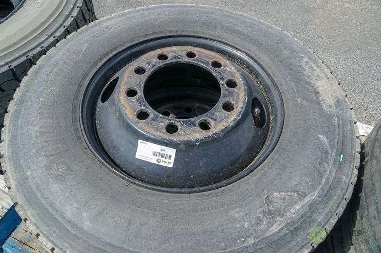 (2) Bridgestone M725 11R22.5 Tires With Wheels - Roller Auctions