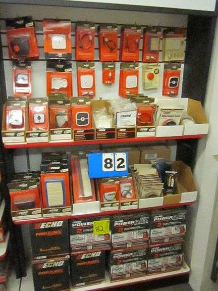 CONTENTS OF SHELF INCLUDING ASSORTED ECHO AIR CLEANING KITS, TUNE-UP ...