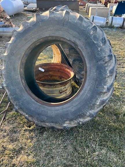 2 16.9-28 tractor tires with John Deere rims - Schmid Auction