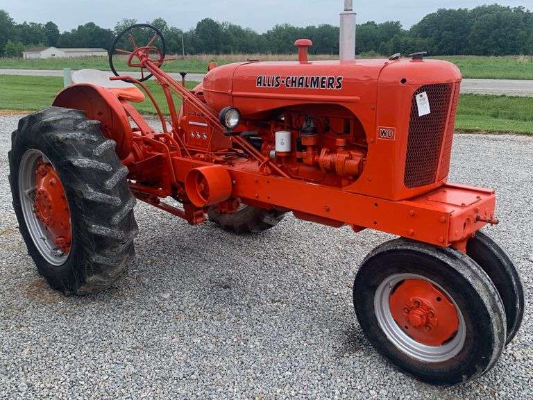 Allis-Chalmers WD tractor, gas, runs good, new paint. - Schmid Auction