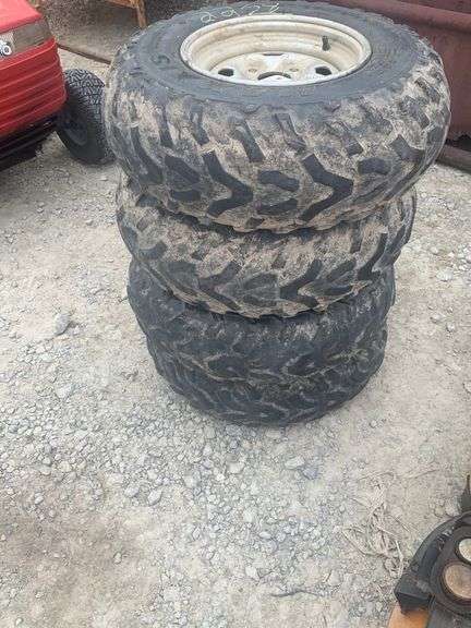 4 Honda 4 wheeler tires/rims - Schmid Auction