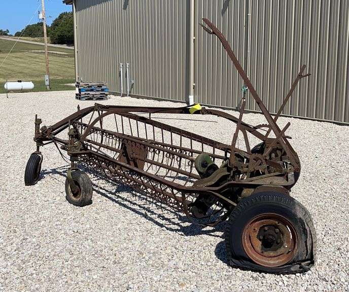 Antique pull type side delivery hay rake - Schneider Auctioneers LLC
