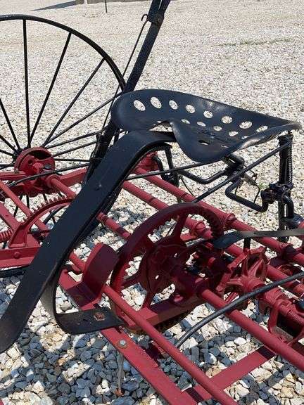 Antique International horse drawn hay tedder - Schneider Auctioneers LLC