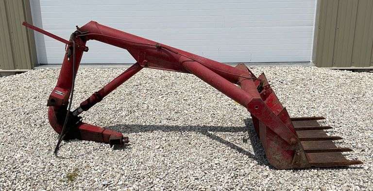 Ford I9-209 one arm loader - Schneider Auctioneers LLC