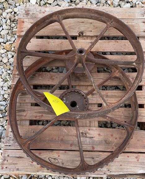 2 antique iron wheels - Schneider Auctioneers LLC