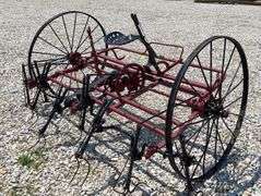 Antique International horse drawn hay tedder - Schneider Auctioneers LLC