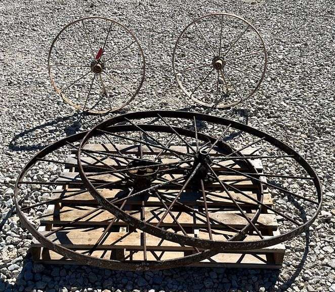 4 antique iron wheels - Schneider Auctioneers LLC
