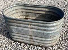 Poly/steel feeder & galv. water trough - Schneider Auctioneers LLC