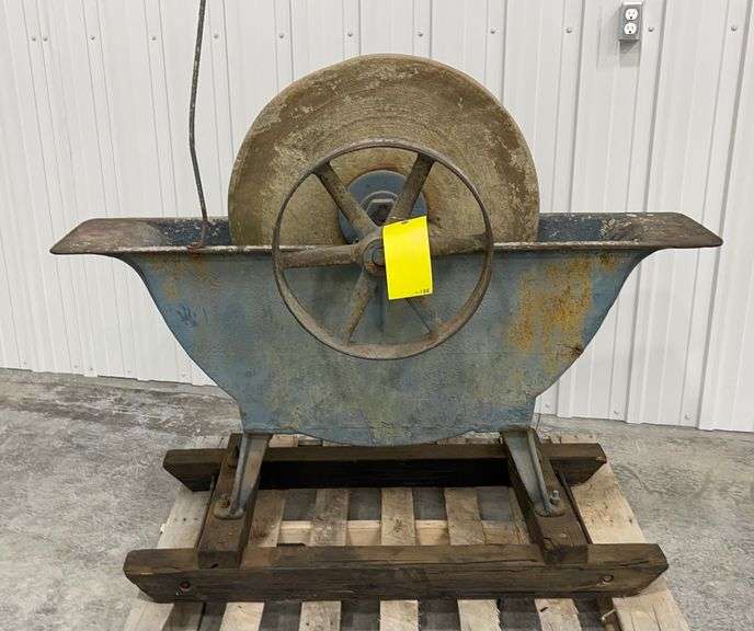 Large antique grindstone w/ cast iron tank - Schneider Auctioneers LLC