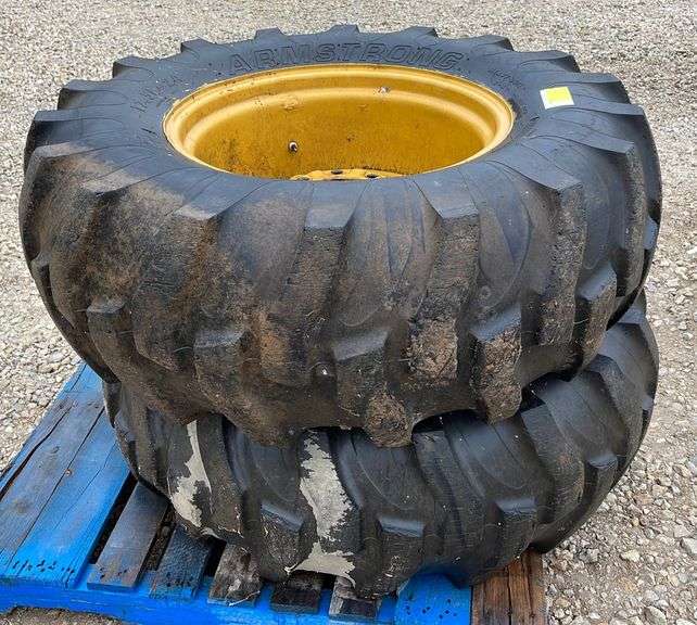 Pair of 17.5L-24 tires on 8-lug rims - Schneider Auctioneers LLC