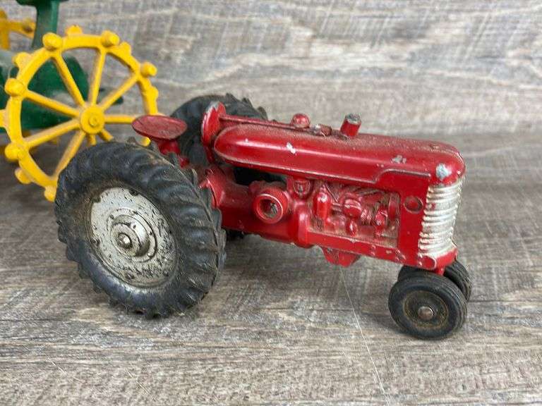 John Deere cast iron & Farmall metal tractors - Schneider Auctioneers LLC