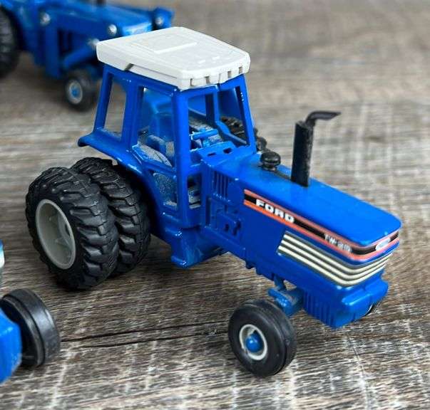 Group of 1/64 Ford tractors - Schneider Auctioneers LLC