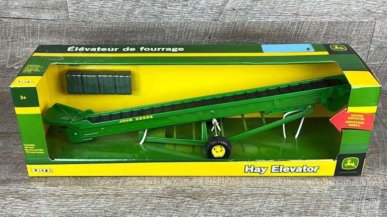 1/16 Ertl John Deere hay elevator w/ bales - Schneider Auctioneers LLC