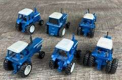 Group of 1/64 Ford tractors - Schneider Auctioneers LLC