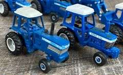 Group of 1/64 Ford tractors - Schneider Auctioneers LLC