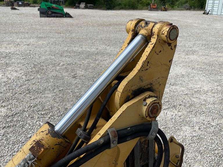 John Deere Pro911 skid steer backhoe attachment - Schneider Auctioneers LLC