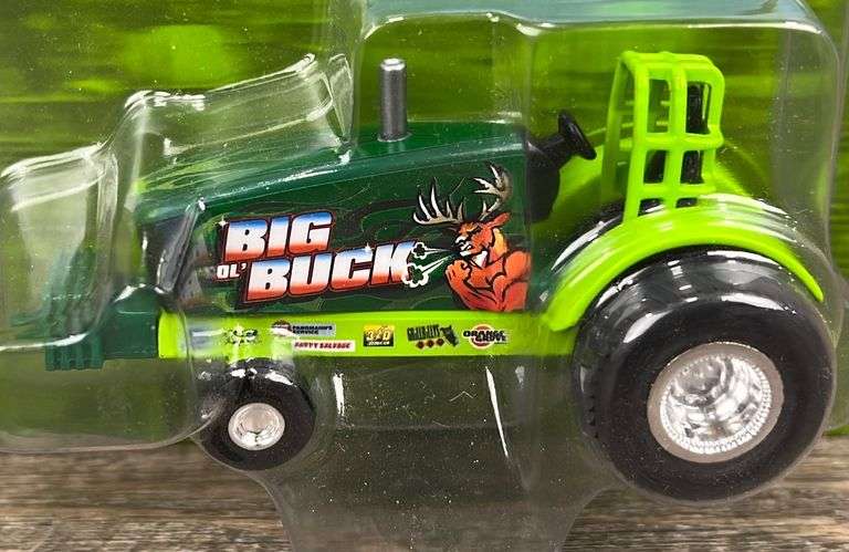 1/64 Ertl Big Ol’ Buck pulling tractor - Schneider Auctioneers LLC