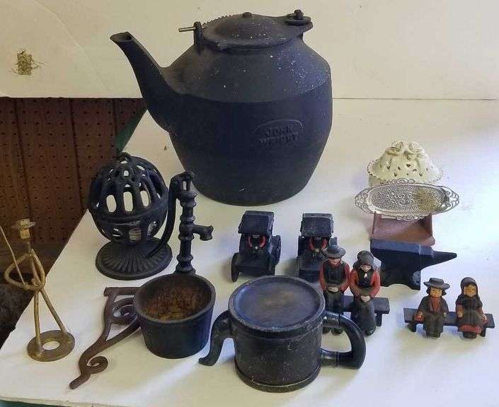 Cast iron pot, amish characters, buggys, water well, anvil and more ...