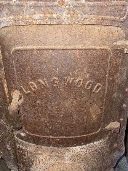 Longwood Cast Iron Wood Stove 3’ tall, top is 24”x17” - Sherwood Auctions