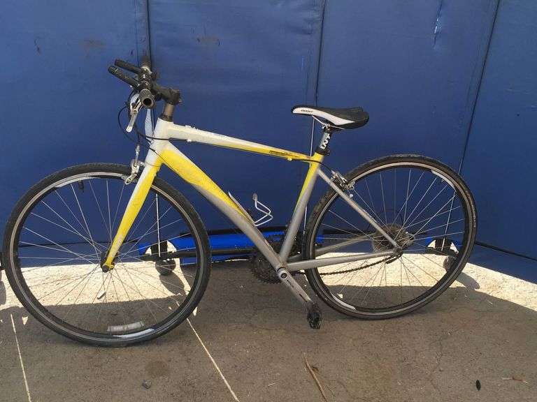 White and Yellow Giant Mountain Bike - Sierra Auction Management Inc