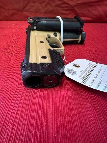 Tan & Black Byrna SD Pepper Gun With Two Mags - Sierra Auction ...
