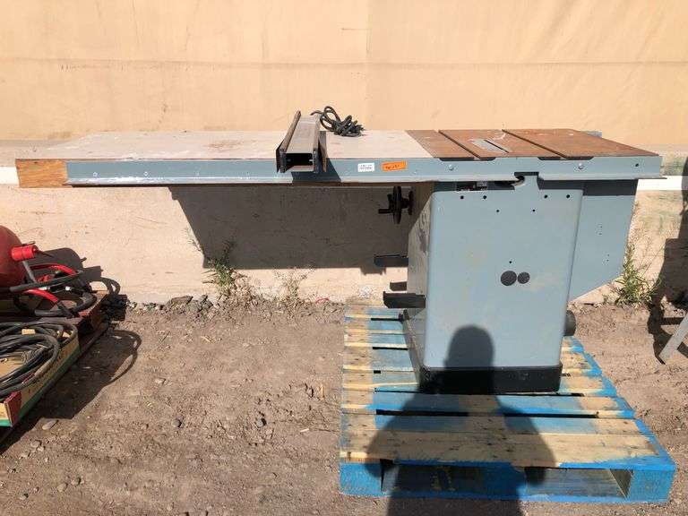 Delta Unisaw 10Inch Tilting Arbor Saw - Sierra Auction Management Inc