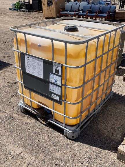 250 gallon liquid container with protective cage and drain spout ...