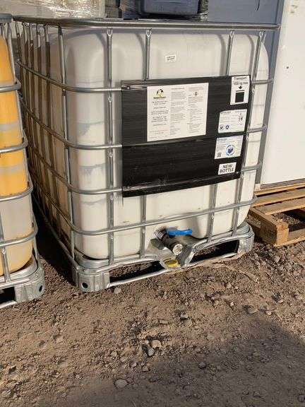 250 gallon liquid container with drain spout and protective cage ...