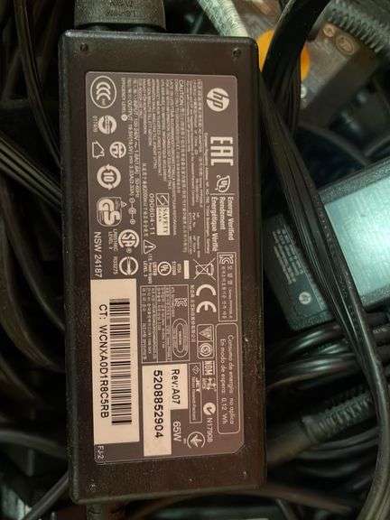 Box With HP Laptop Charging Cables - Sierra Auction Management Inc