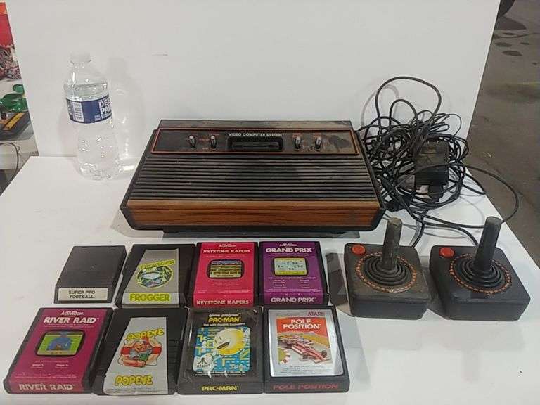 Vintage Atari 2600 Woodgrain Console and 8 Games - Trice Auctions