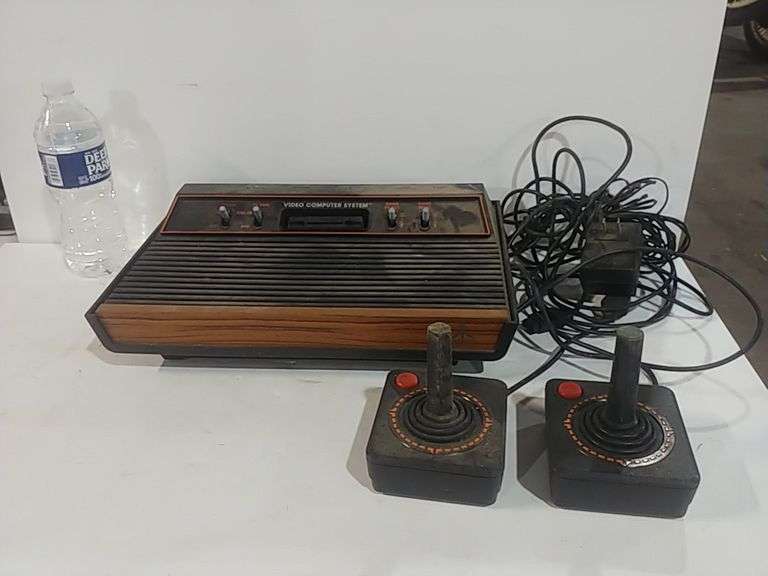Vintage Atari 2600 Woodgrain Console and 8 Games - Trice Auctions