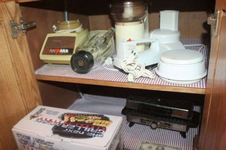 Cabinet full of vintage kitchen appliances including Oster blender, The ...