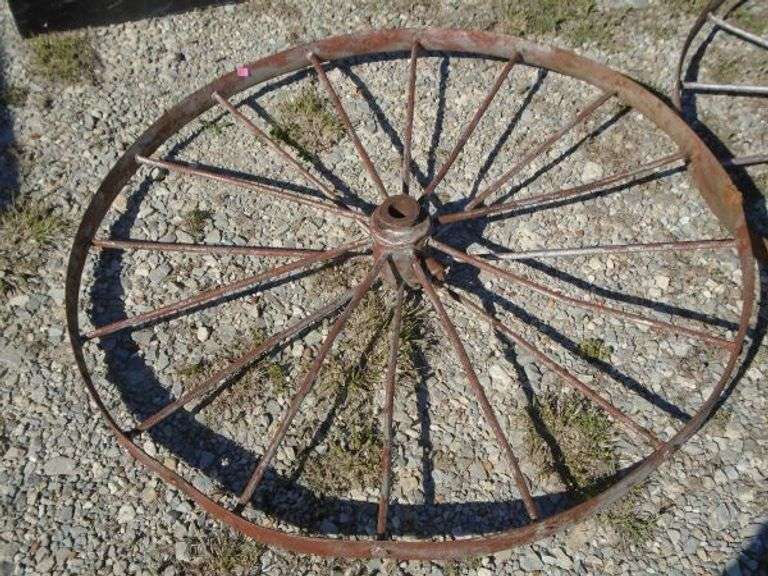 Antique metal spoke wagon wheel. 1 of 2 - Texas Online Auction House
