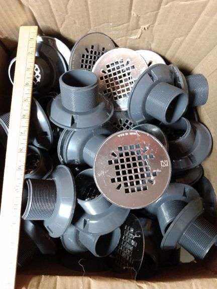 Box full of floor drains marked MADE IN USA - Texas Online Auction House