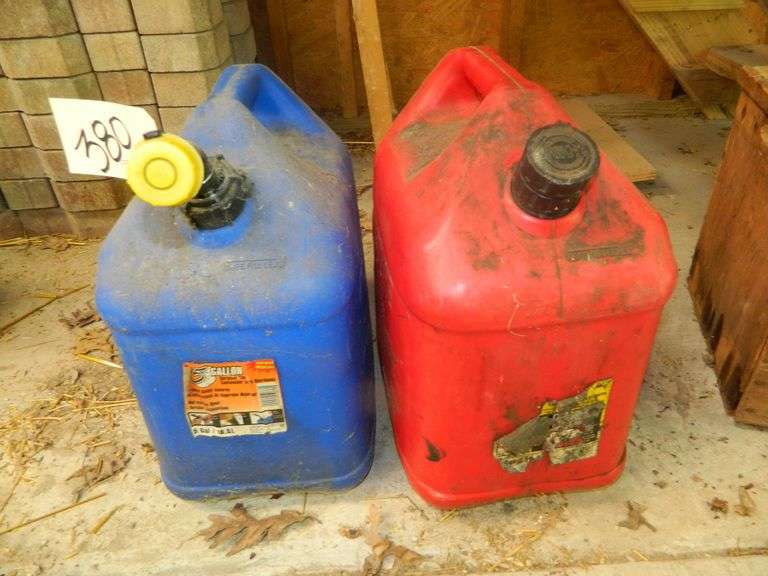 Two 5 Gal cans (1 kerosene and 1 gasoline) - Wolfe Auction & Realty, LLC