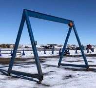 "A" FRAME HOIST, APPROX SIZE 12'H X 16'L X 8.5 W, ON WHEELS, 5 TON BEAM ...