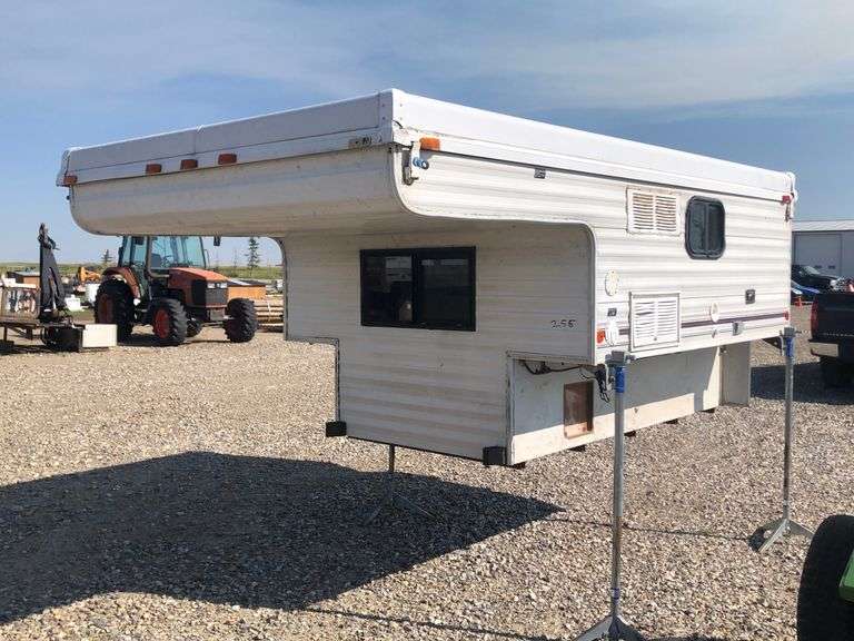 1993 SCAMPER 080S TRUCK BED POPUP CAMPER - Wild Rose Auction Services